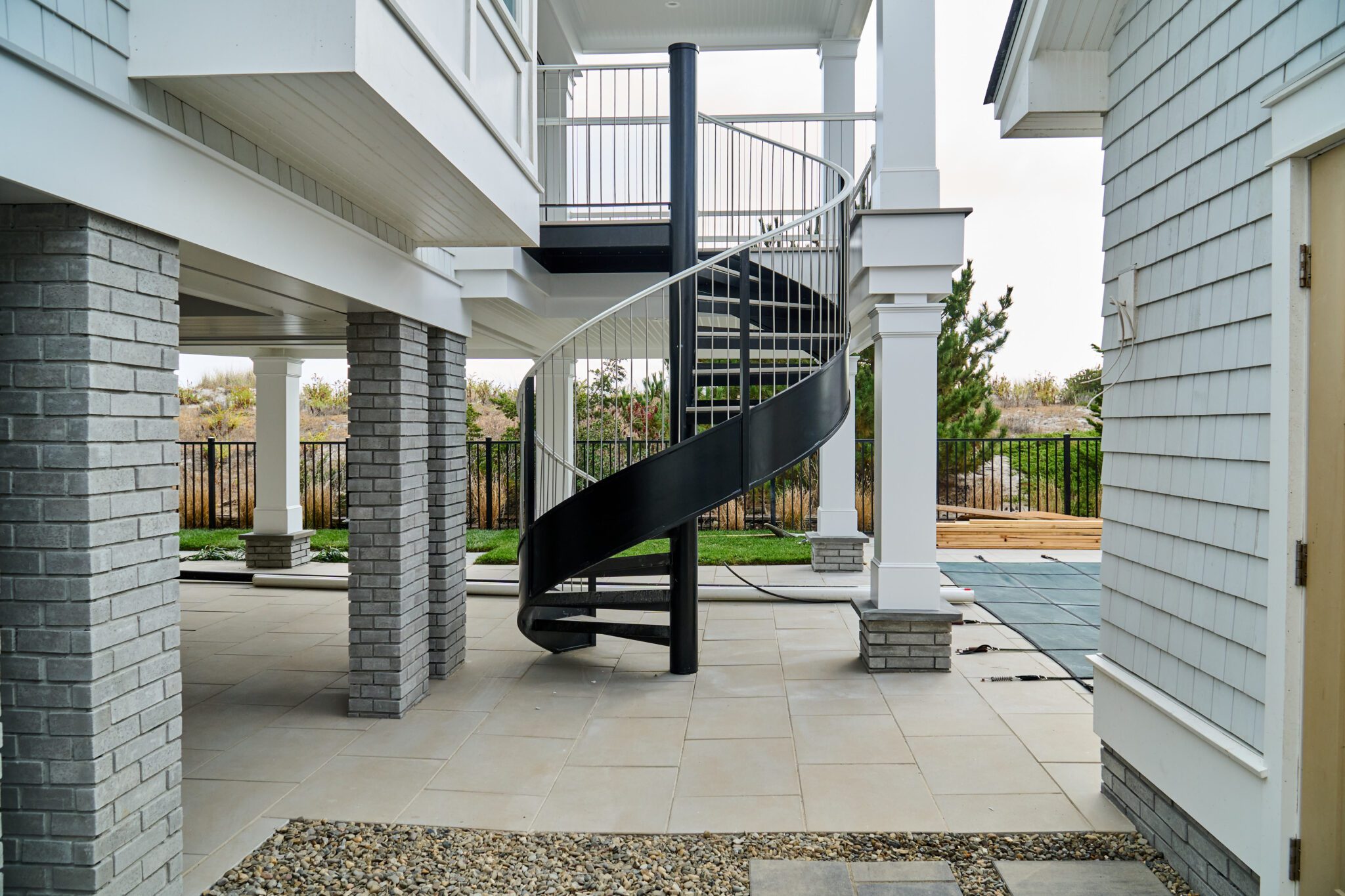 Defining the Difference in Custom Radial Staircases - Compass Ironworks