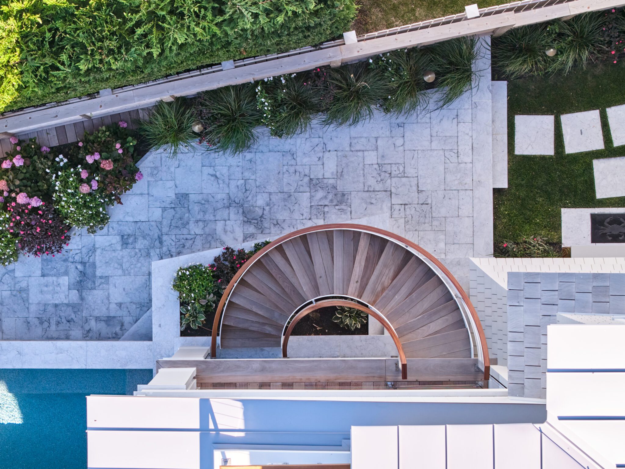 Defining the Difference in Custom Radial Staircases - Compass Ironworks